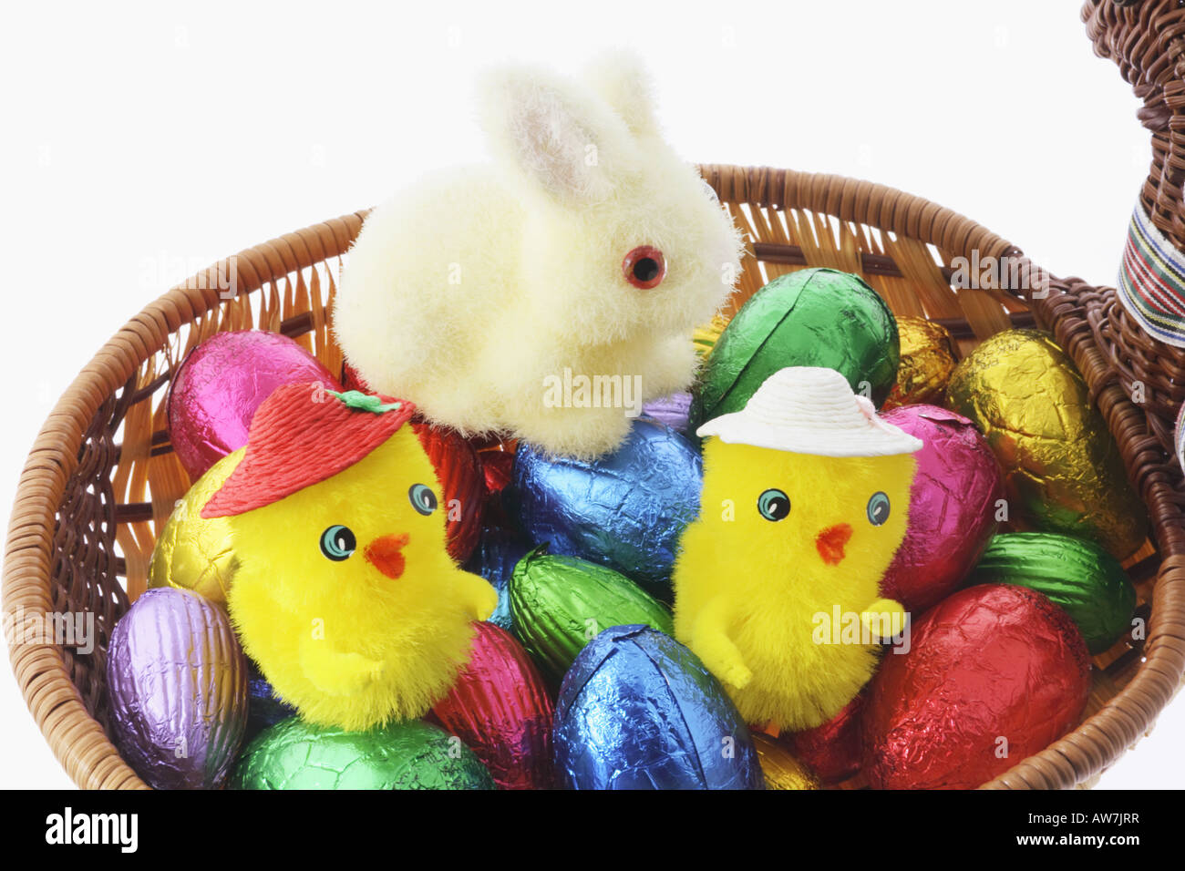 Toy Chicks and Bunny with Chocolate Easter Eggs in Basket Stock Photo ...