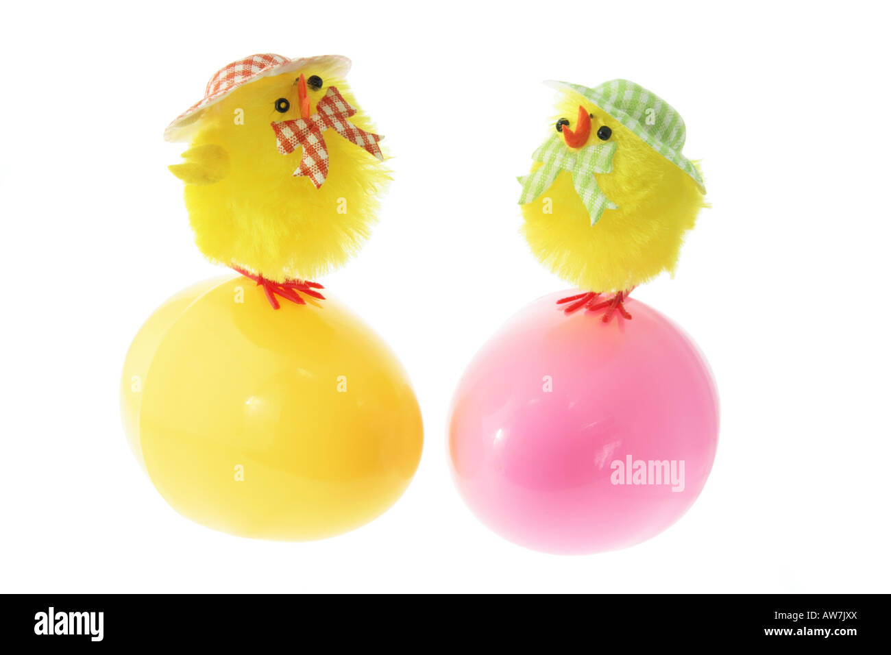 Toy Chicks on Plastic Easter Eggs Stock Photo - Alamy