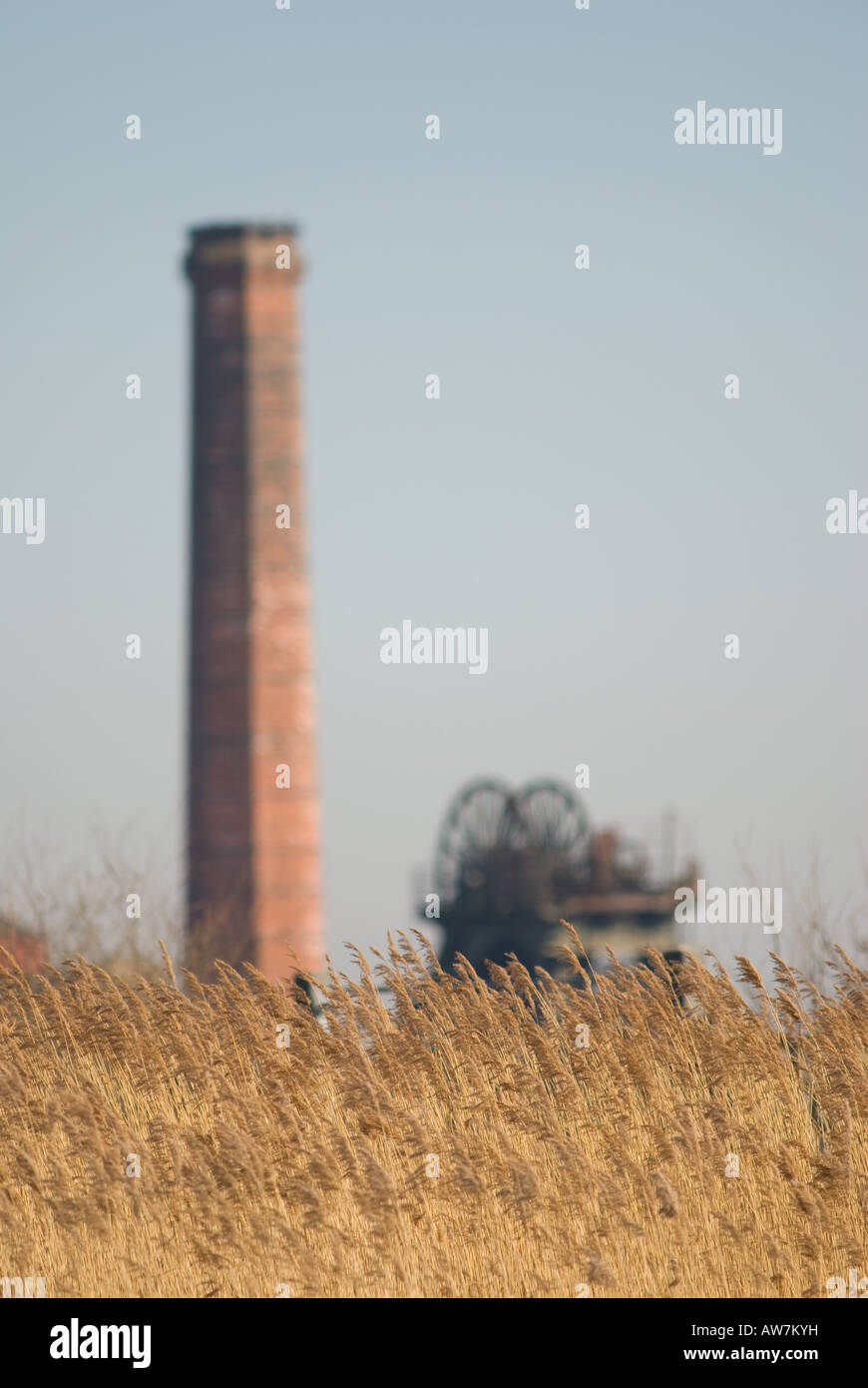 Pleasley colliery winding wheel and chimney stack Stock Photo - Alamy