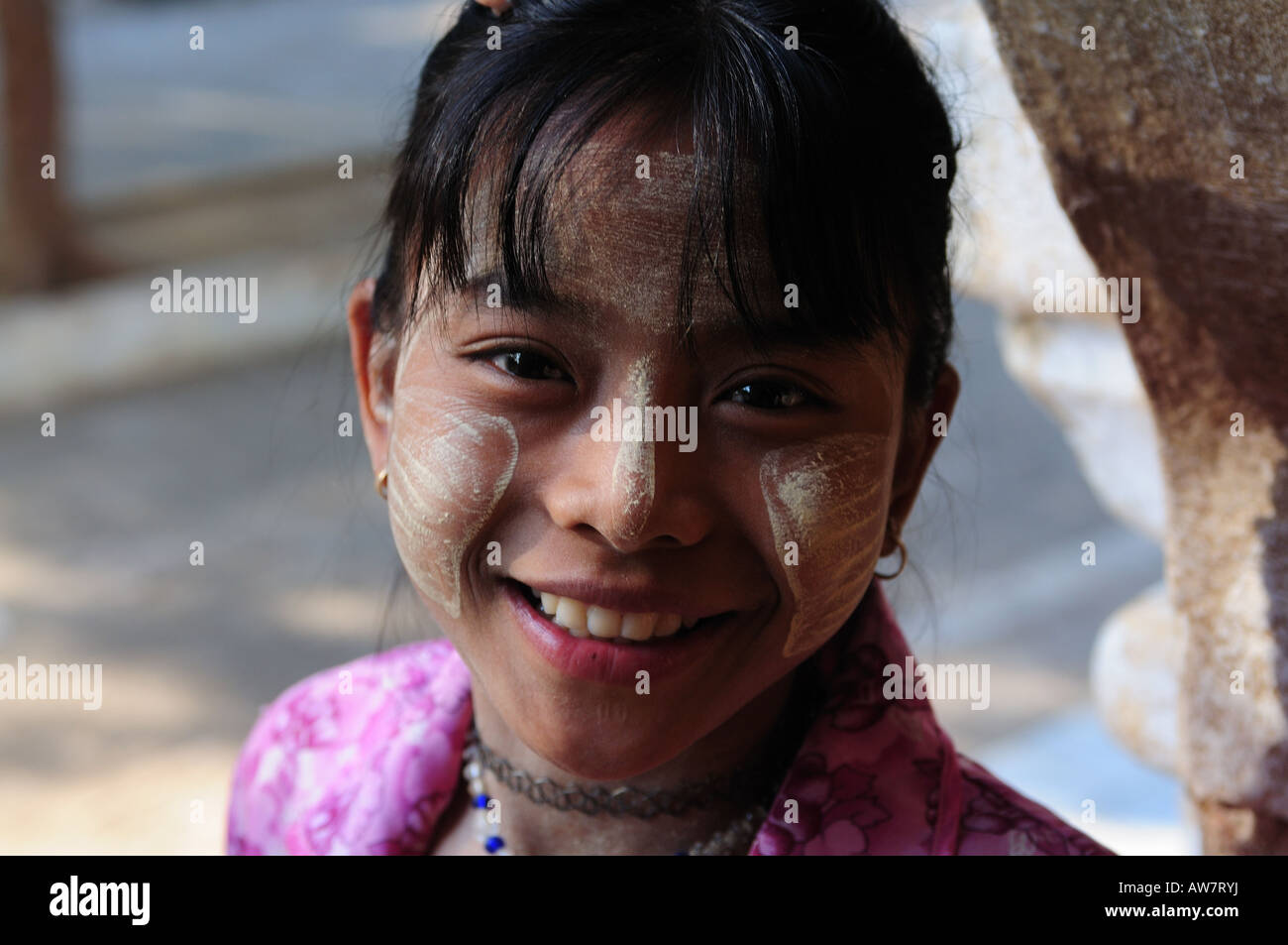 Young friendly girl with traditional makeup smiles in the camera Bagan ...