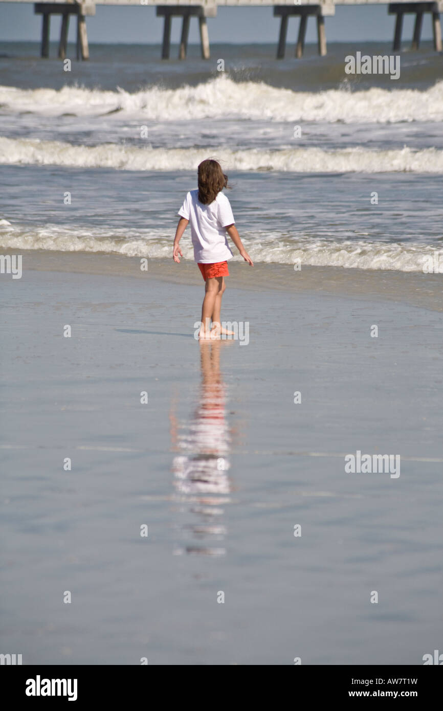 A child paddling in the Atlantic Ocean, Jacksonville Beach, Florida ...