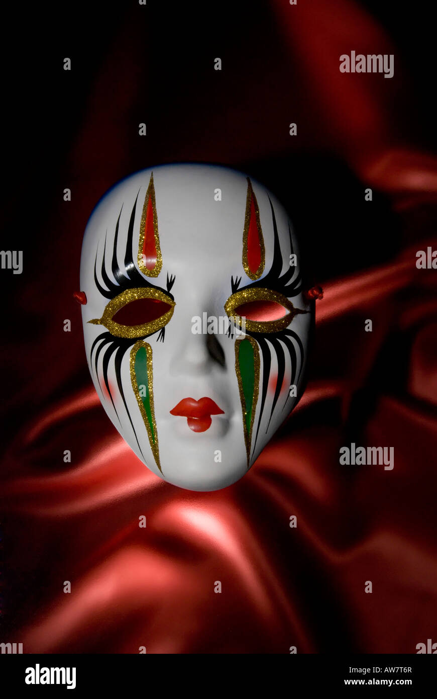 Object masquerade mask on silk background Stock Photo - Alamy