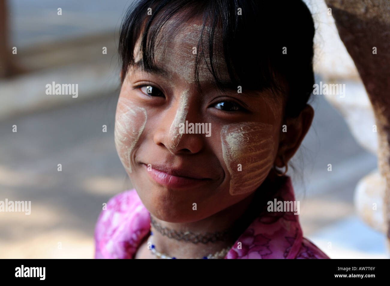 Young friendly girl with traditional makeup smiles in the camera Bagan ...