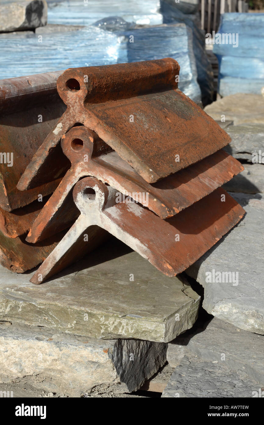 Old ridge roof tile at a building material reclamation salvage yard ...