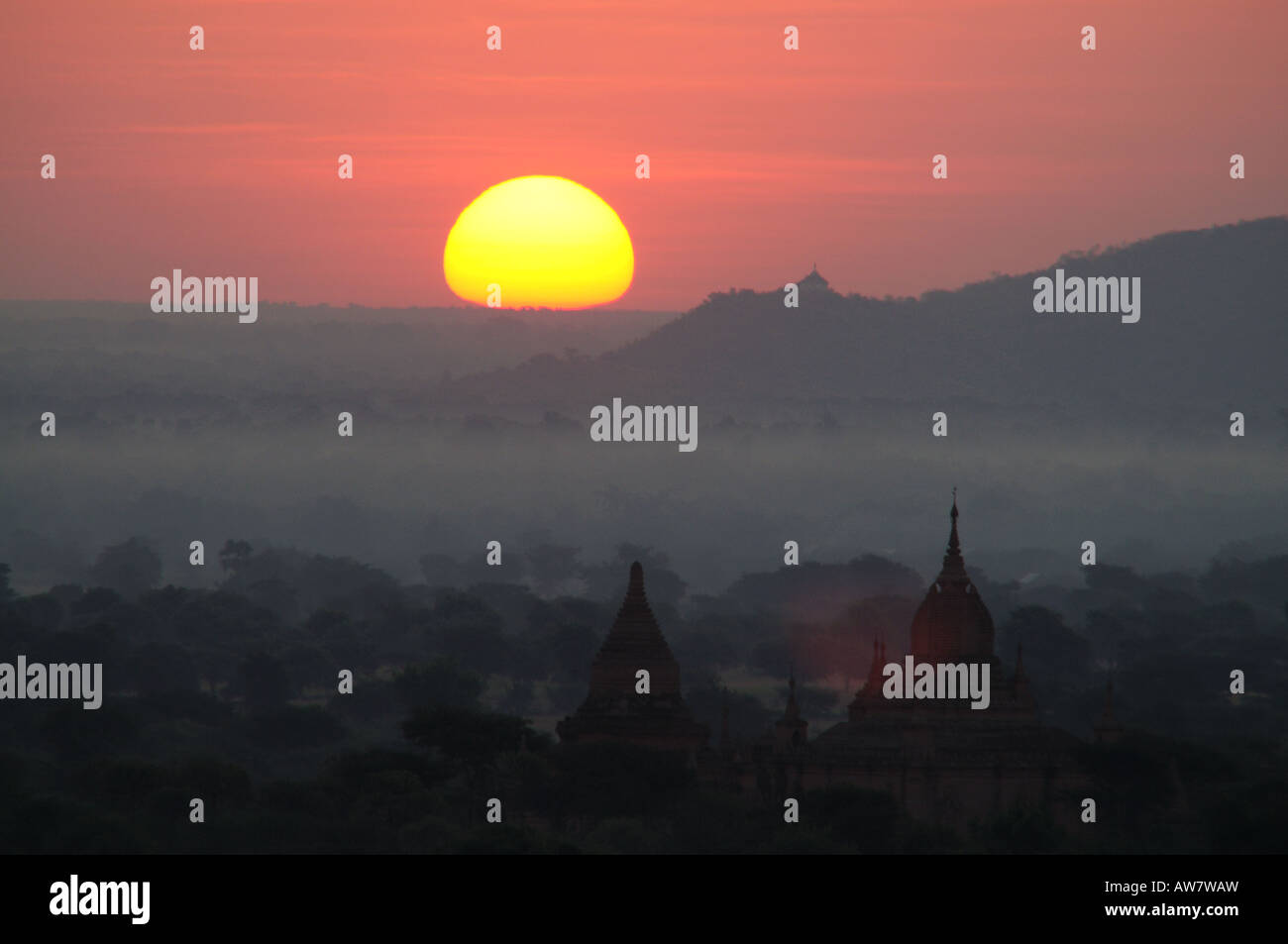 Sun rise above the temples and pagodas of the old ruined city Bagan ...
