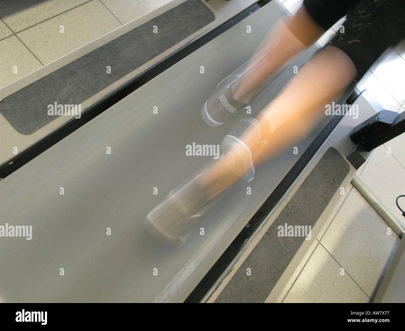 person running on indoor running track Stock Photo - Alamy