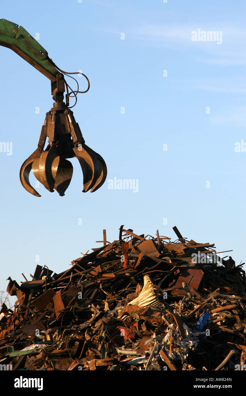Heaps of scrap metal and a crane Stock Photo - Alamy