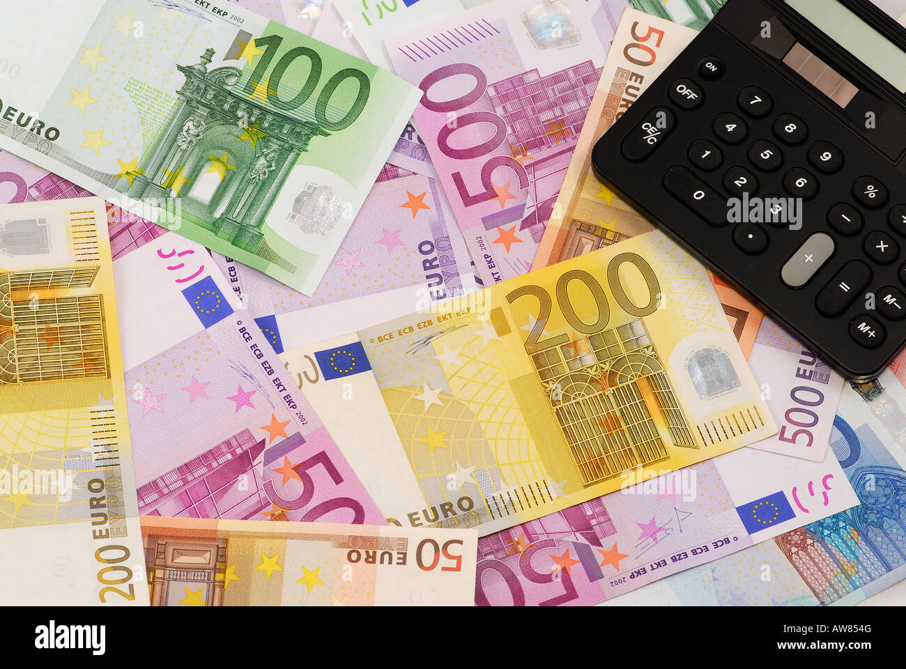 Euro banknotes and calculator Stock Photo - Alamy
