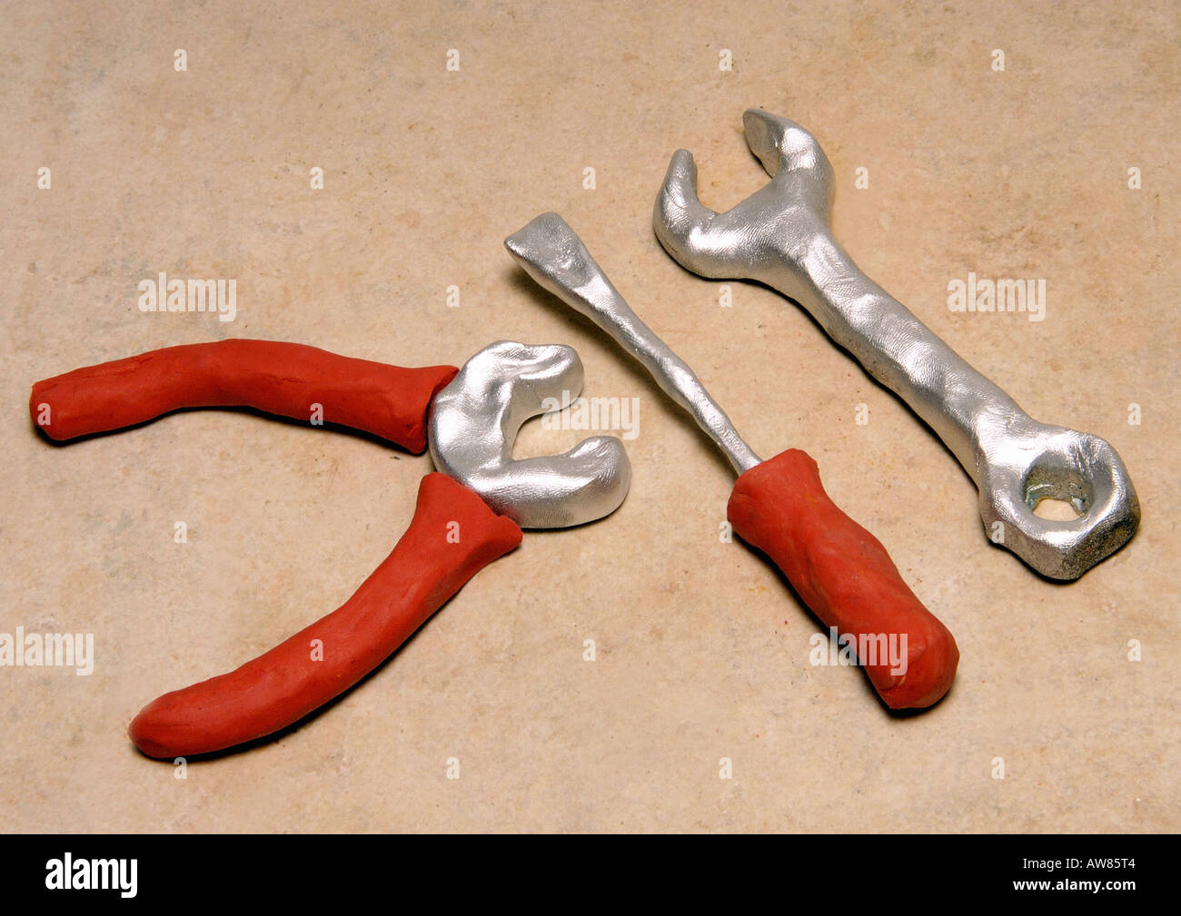 Pliers, flathead screwdriver, and key tools Stock Photo - Alamy