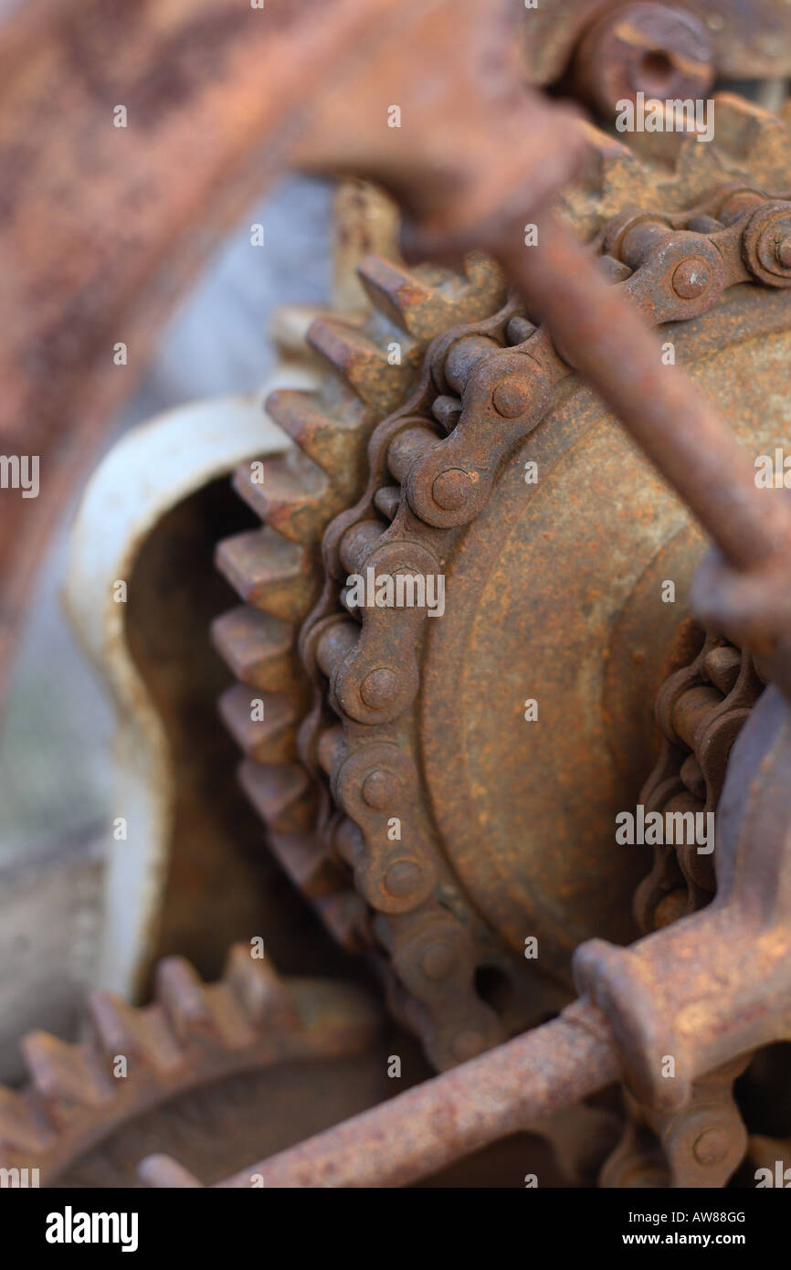 Old rusty mechanical chain gear cog wheel on neglected farm machinery ...