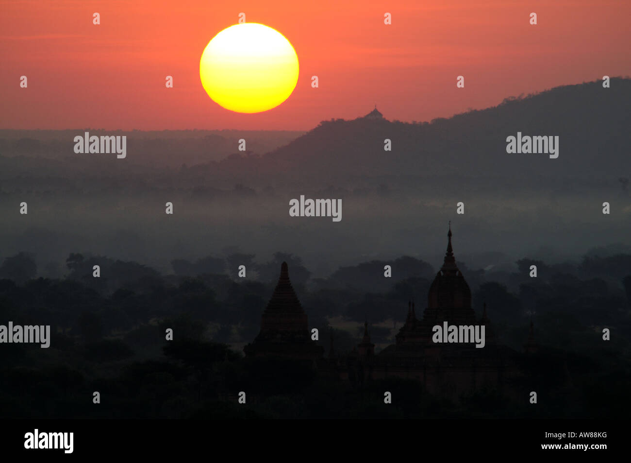 Sun rise above the temples and pagodas of the old ruined city Bagan ...