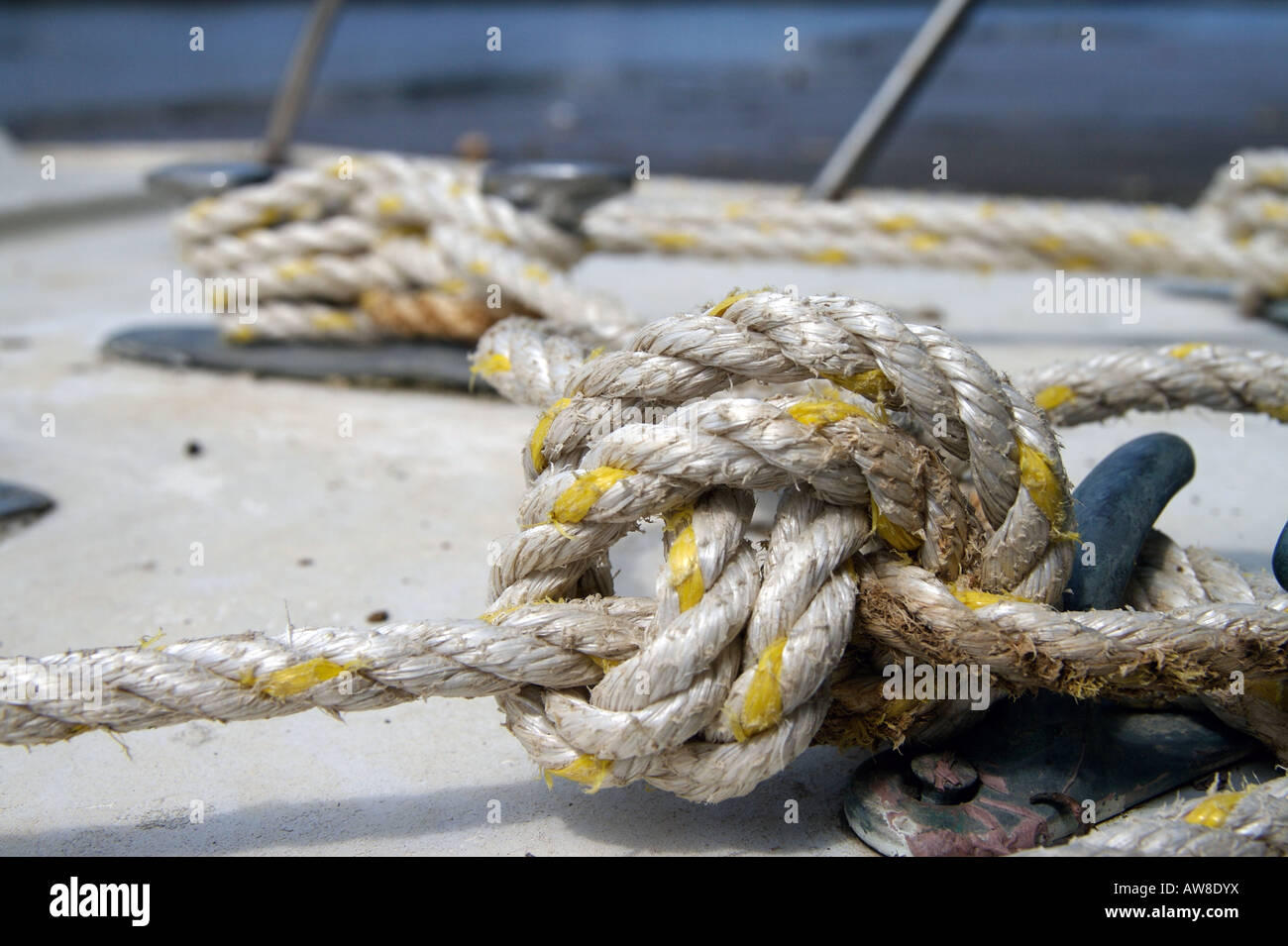 Knots in a rope on a boat's deck Stock Photo - Alamy