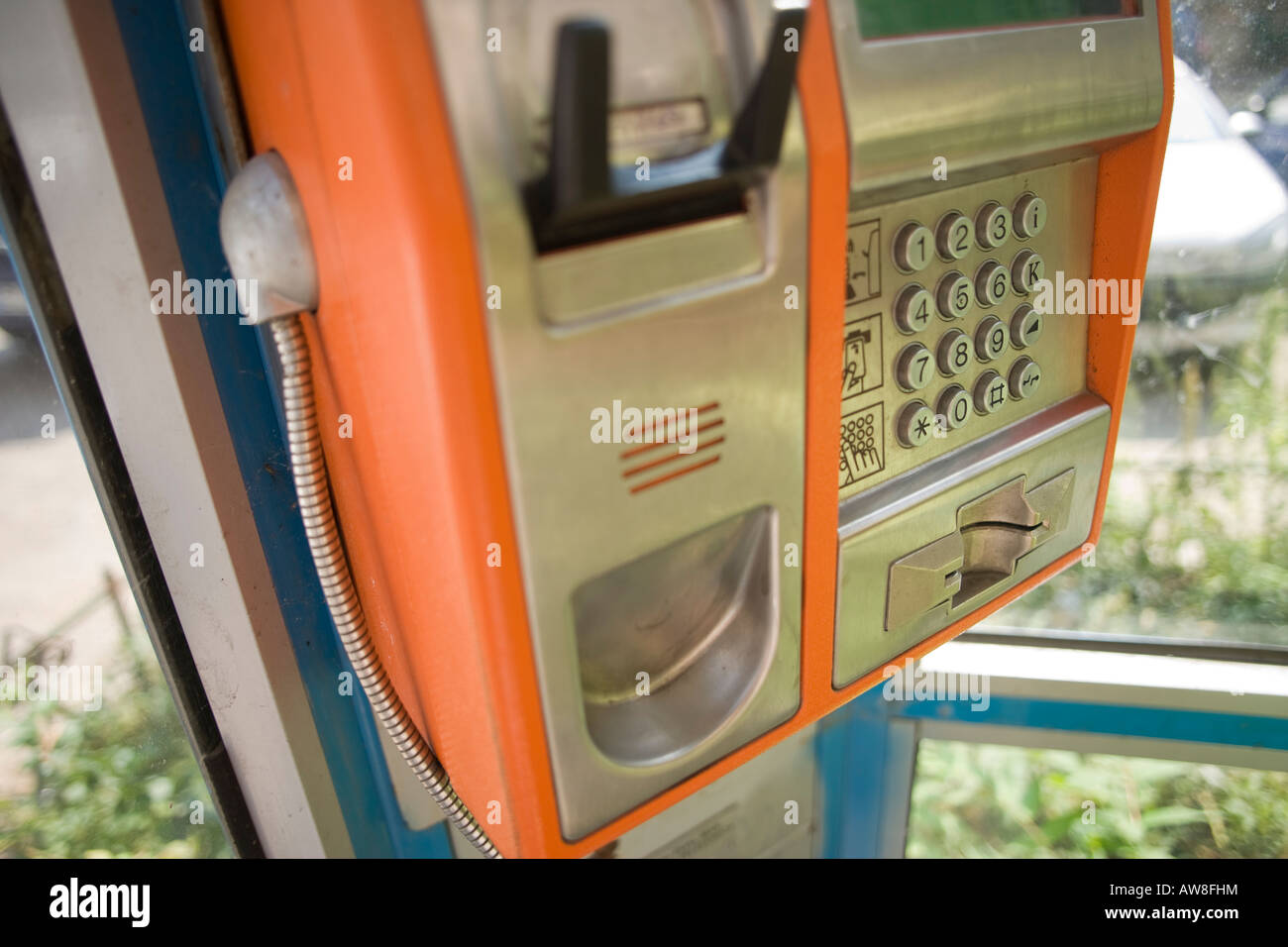 orange public telephone Stock Photo - Alamy