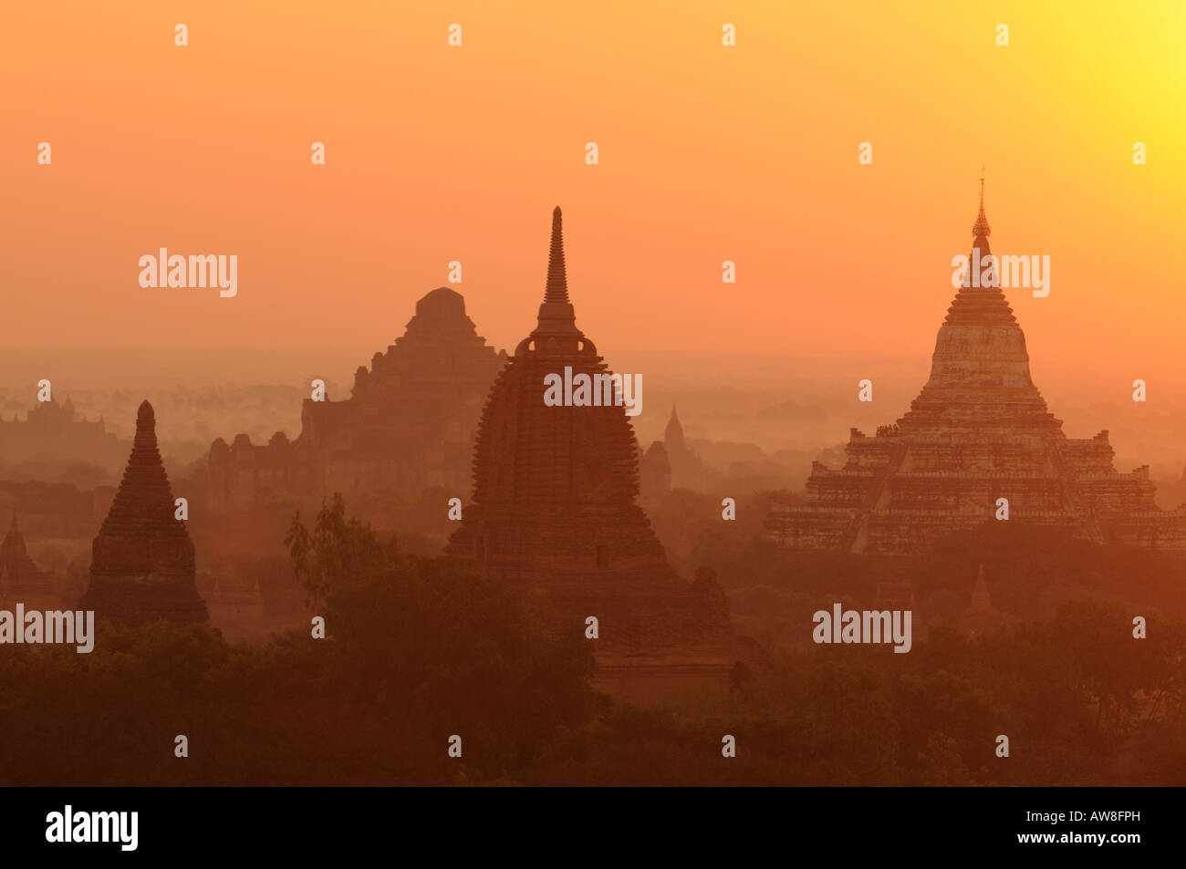 Sun rise above the temples and pagodas of the old ruined city Bagan ...