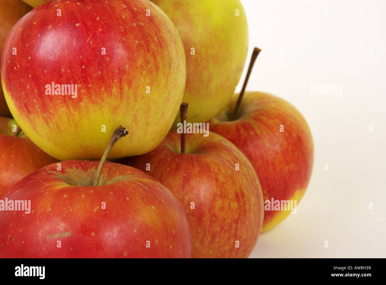 Fresh Apples forming a pyramid On white background Stock Photo - Alamy