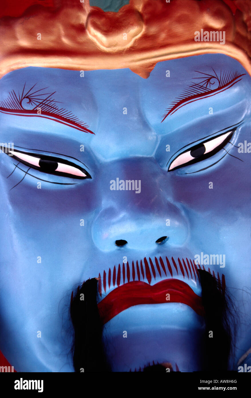 Chinese mask of man's face Stock Photo - Alamy