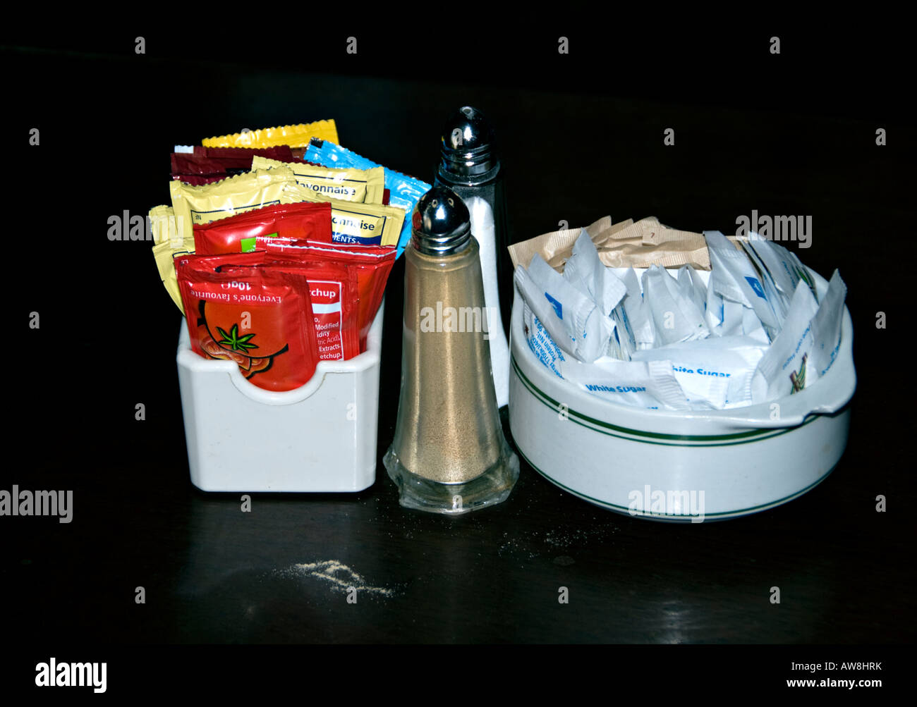 A grouping of condiments on a pub table Stock Photo - Alamy