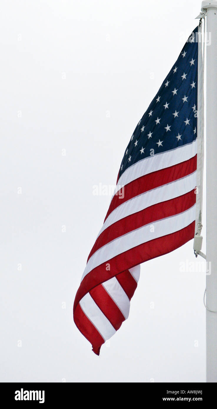The American flag waving US flag hanging on a pole isolated white ...