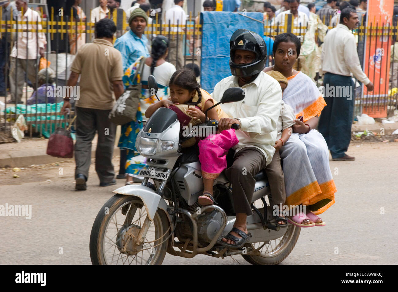 The whole family can ride on a single moped in Bangalore s traffic ...