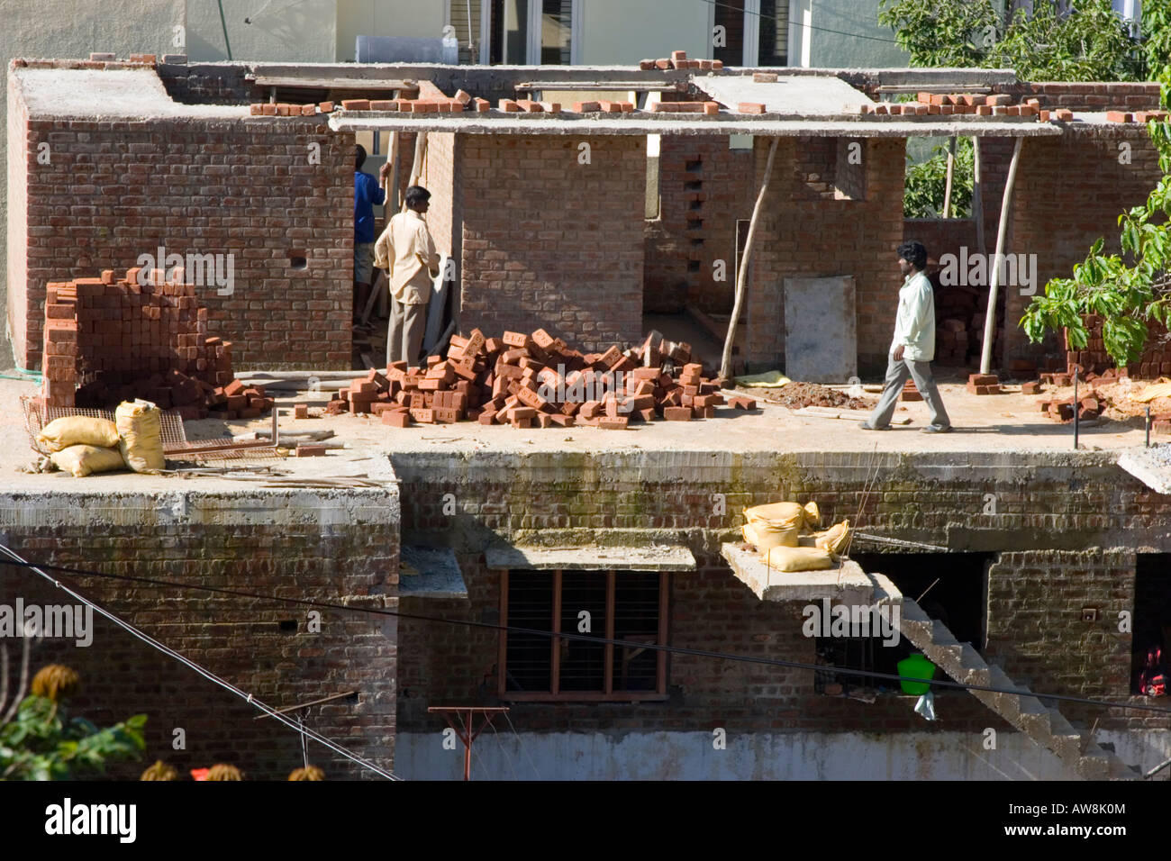Builders on an Indian construction site building a new house Stock ...