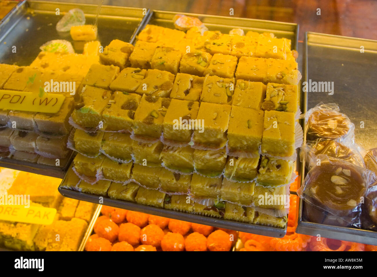 Indian sweets on sale and displayed in an Indian sweet shop Stock Photo ...