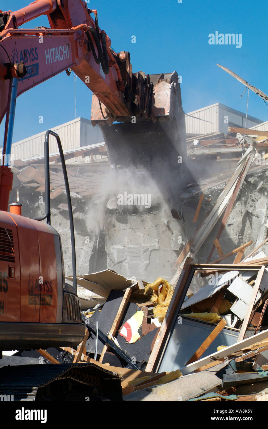 A backhoe demolishes a house, photo by Bruce Miller 2008 Stock Photo ...