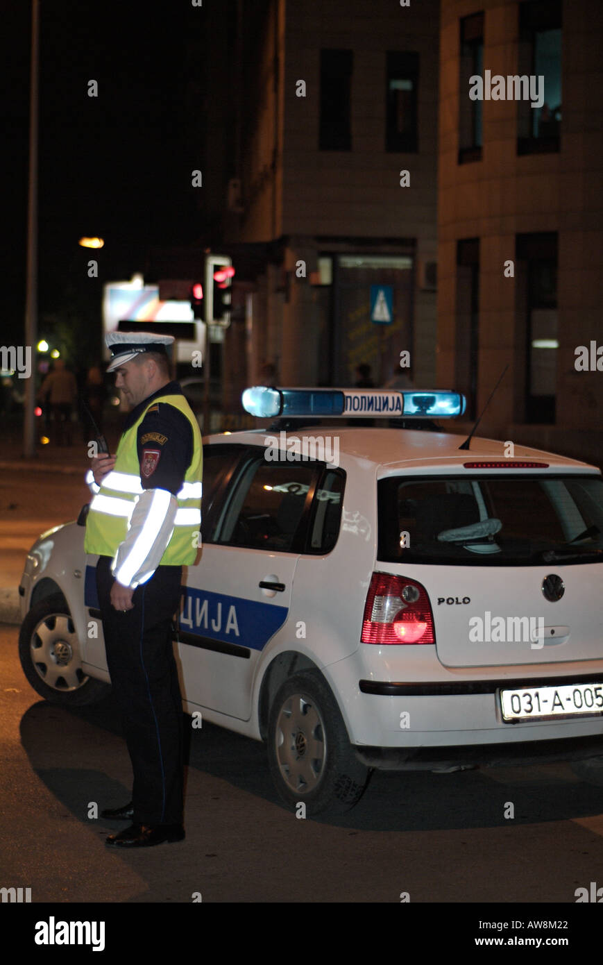 Police Car And Policeman Blocking Road High Resolution Stock ...