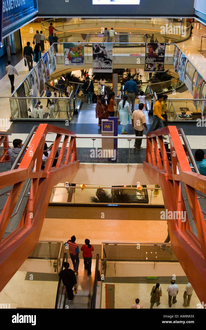 Shops and escalators inside a modern Indian shopping mall and shopping ...