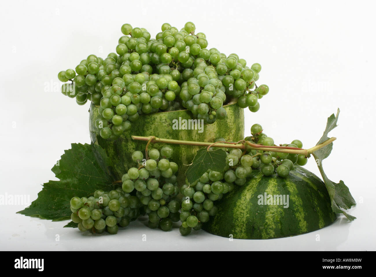 Artistic composition of a watermelon with green grapes images pictures ...