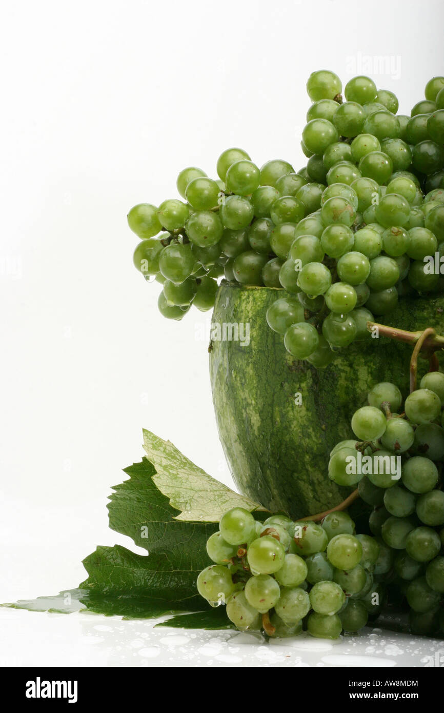 Artistic composition of a watermelon with green grapes fruit close up ...