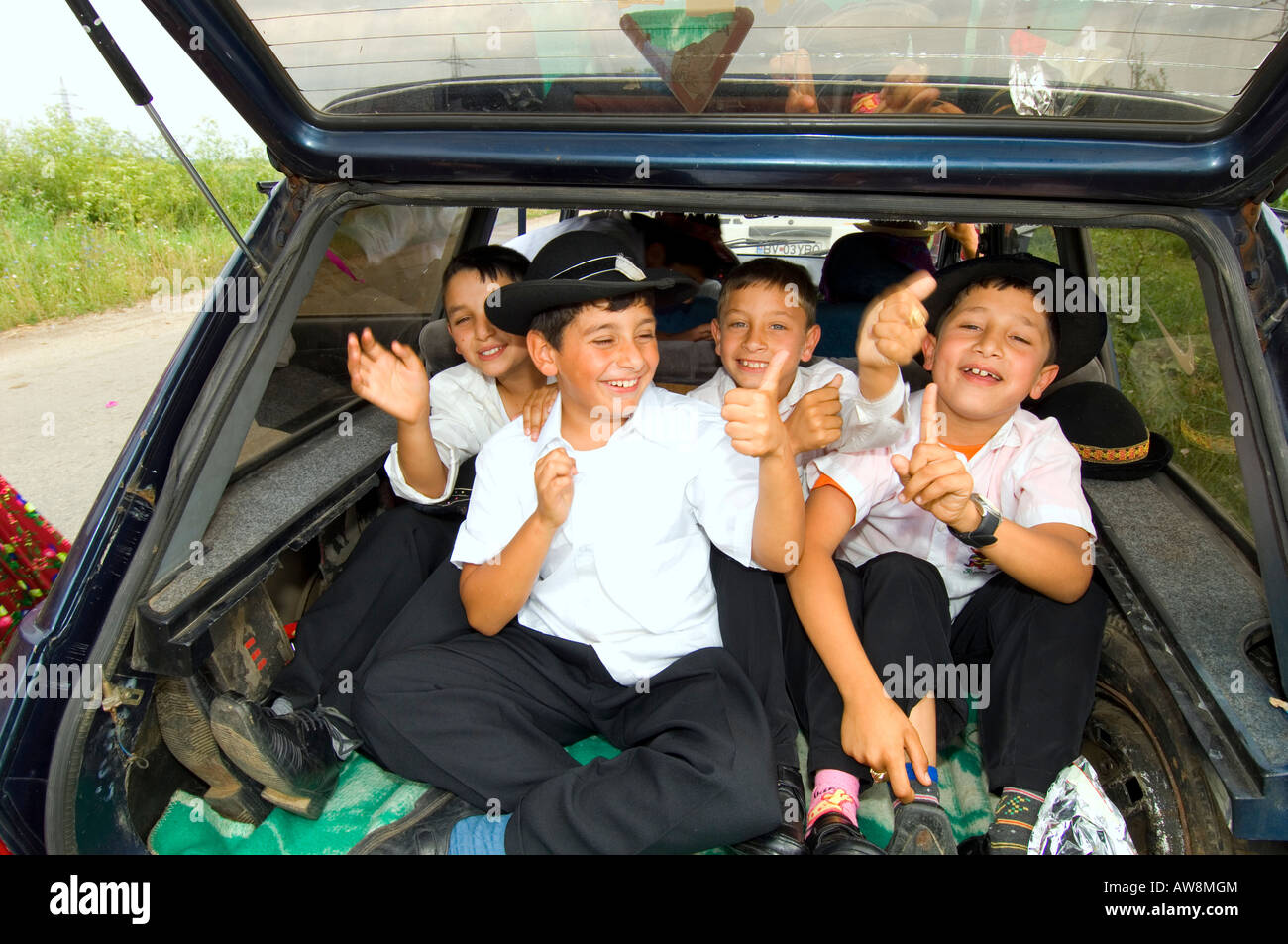 Young Gypsy boys in boot of a car Stock Photo - Alamy