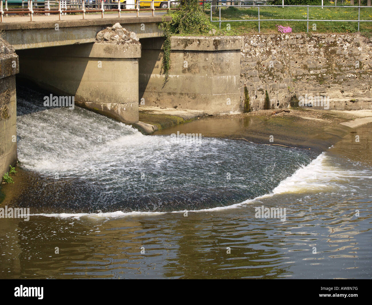 fast flowing modern stone shallow weir white water Stock Photo - Alamy