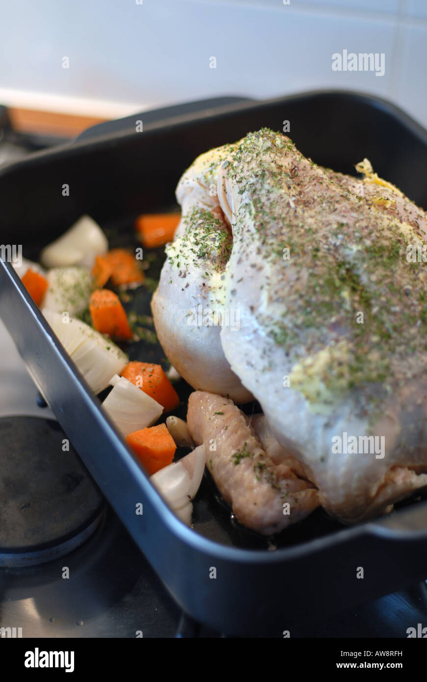 A chicken in the roasting dish Stock Photo - Alamy