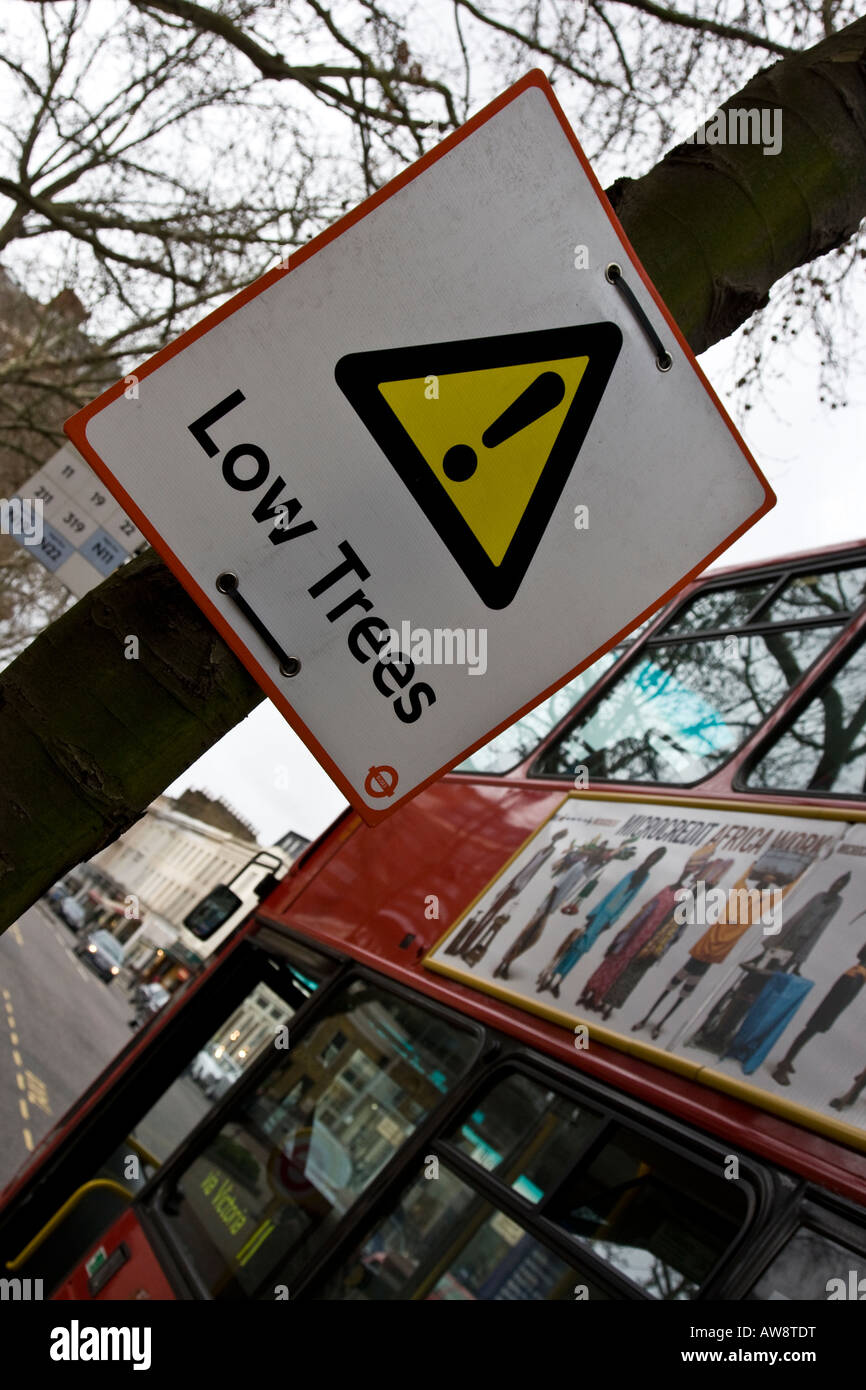Low Trees sign at a bus stop Stock Photo - Alamy