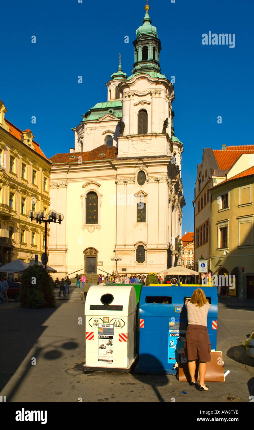 A woman using recycling bins in central Prague the capital of Czech ...