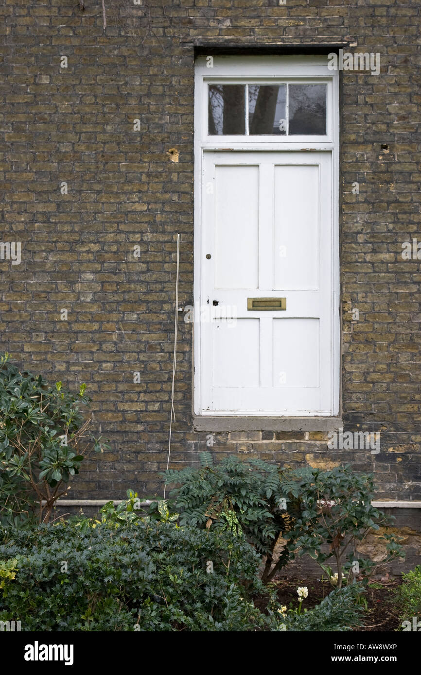 White door with no way in Stock Photo - Alamy