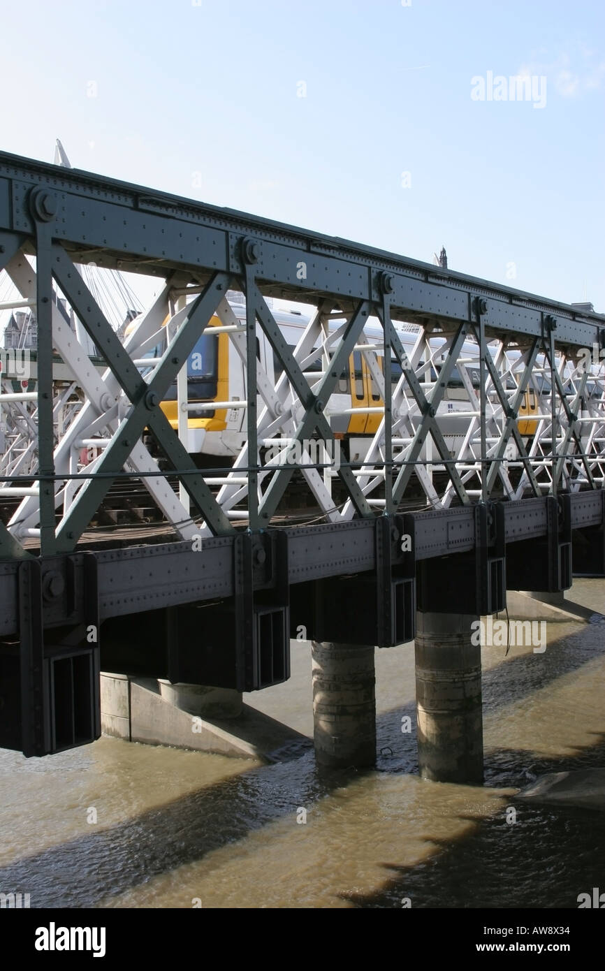 Victorian Hungerford Railway bridge structure across Thames River ...