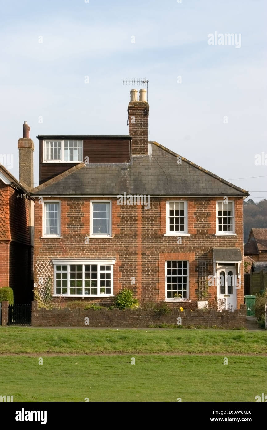 Semi detached brick houses with roof extension in Reigate Surrey ...