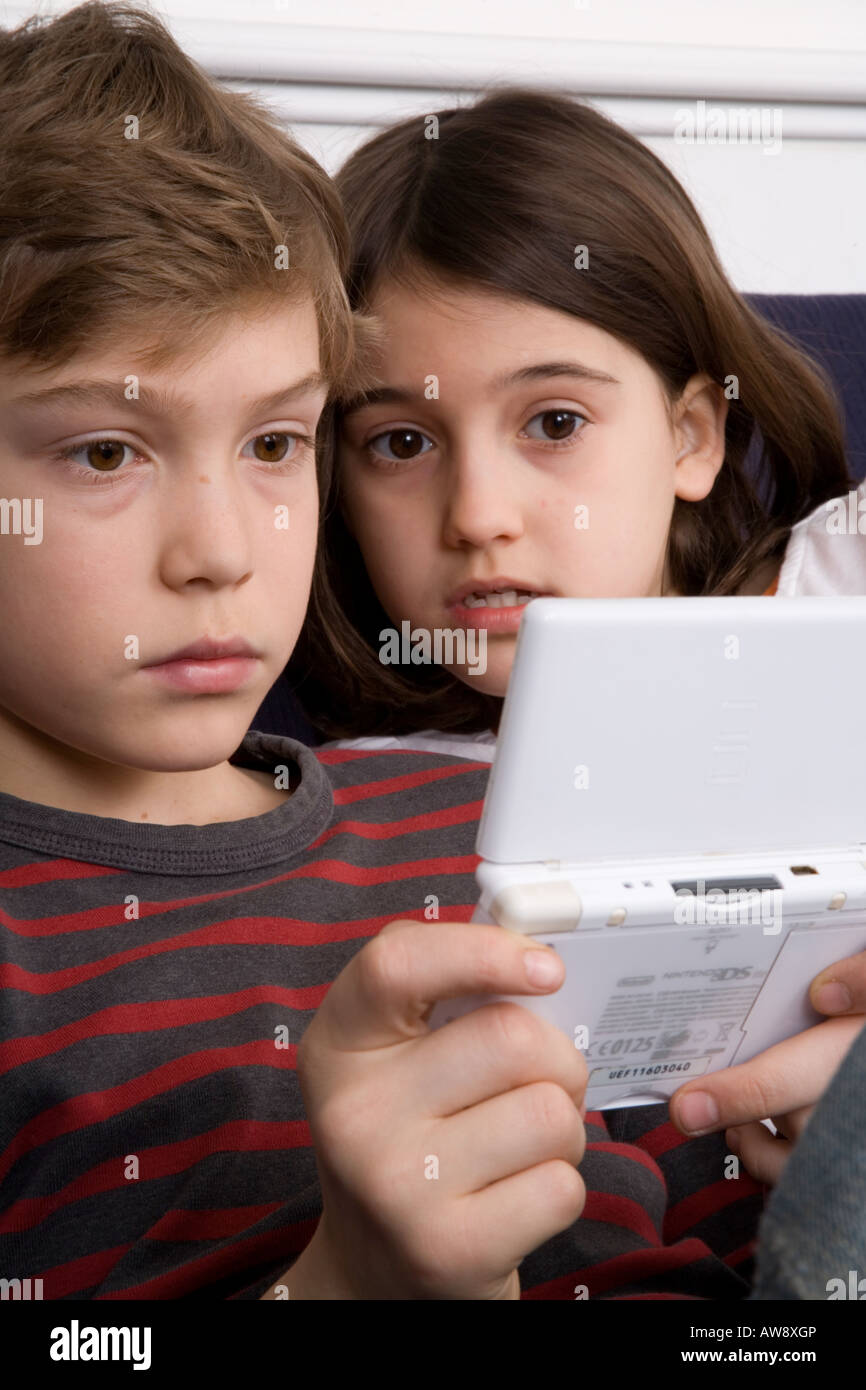 children playing with Nintendo DS Stock Photo - Alamy