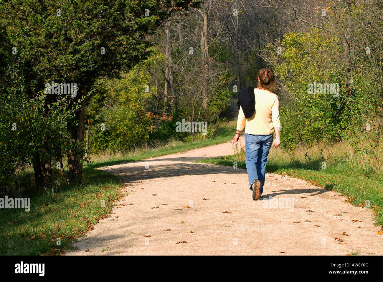 Woman walking exercise path Stock Photo - Alamy