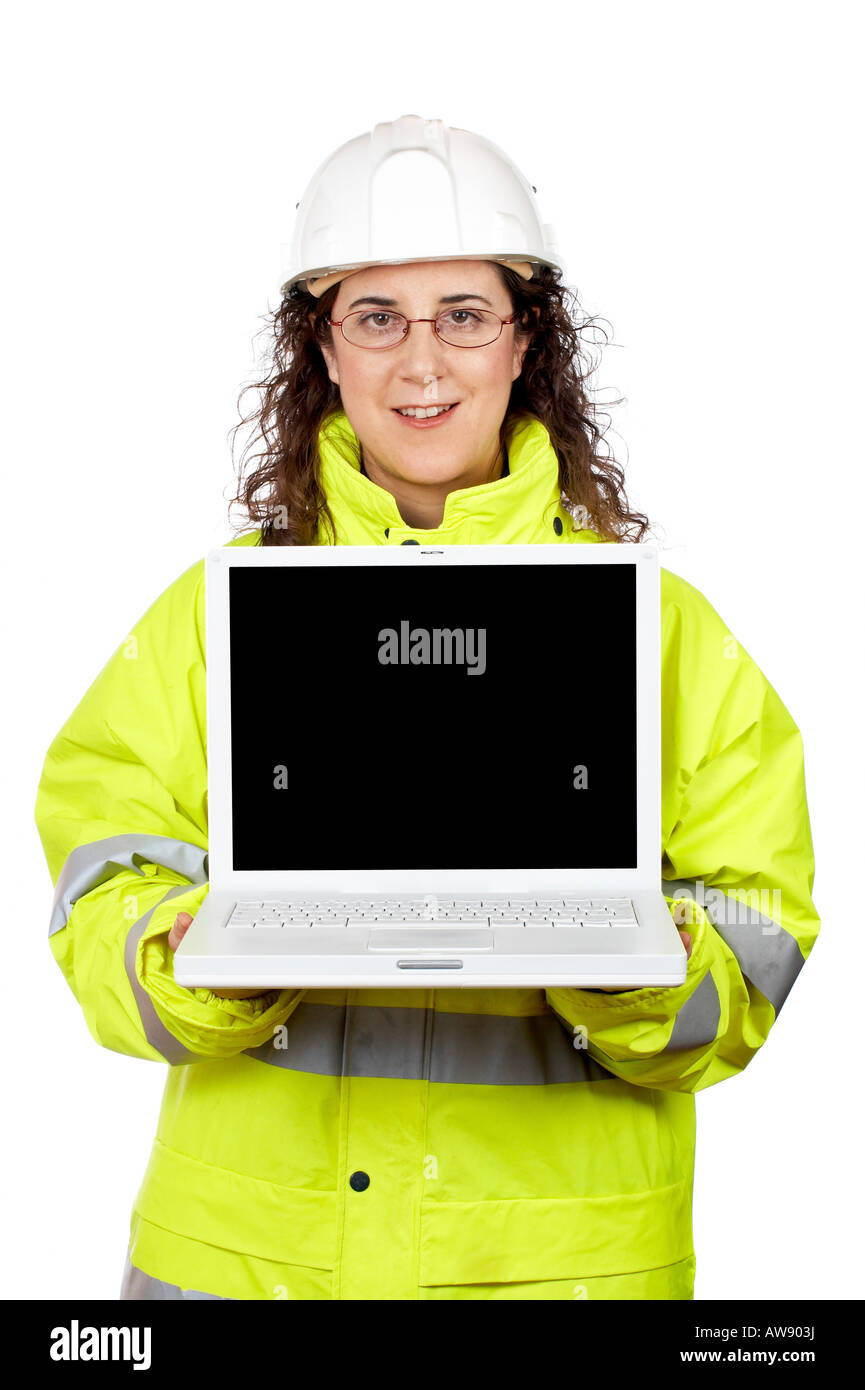 Female construction worker showing a laptop over a white background ...