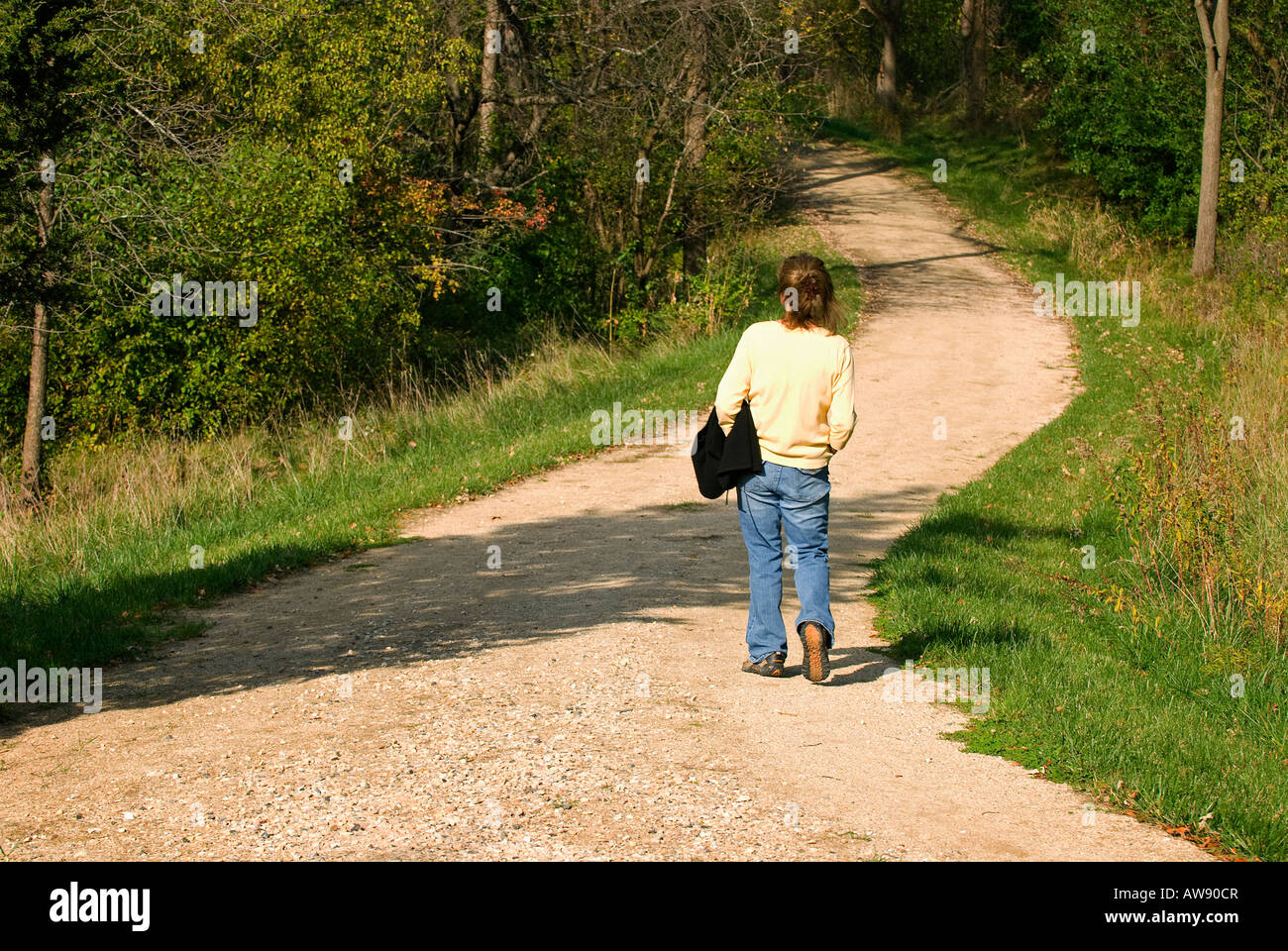 Woman walking exercise path Stock Photo - Alamy