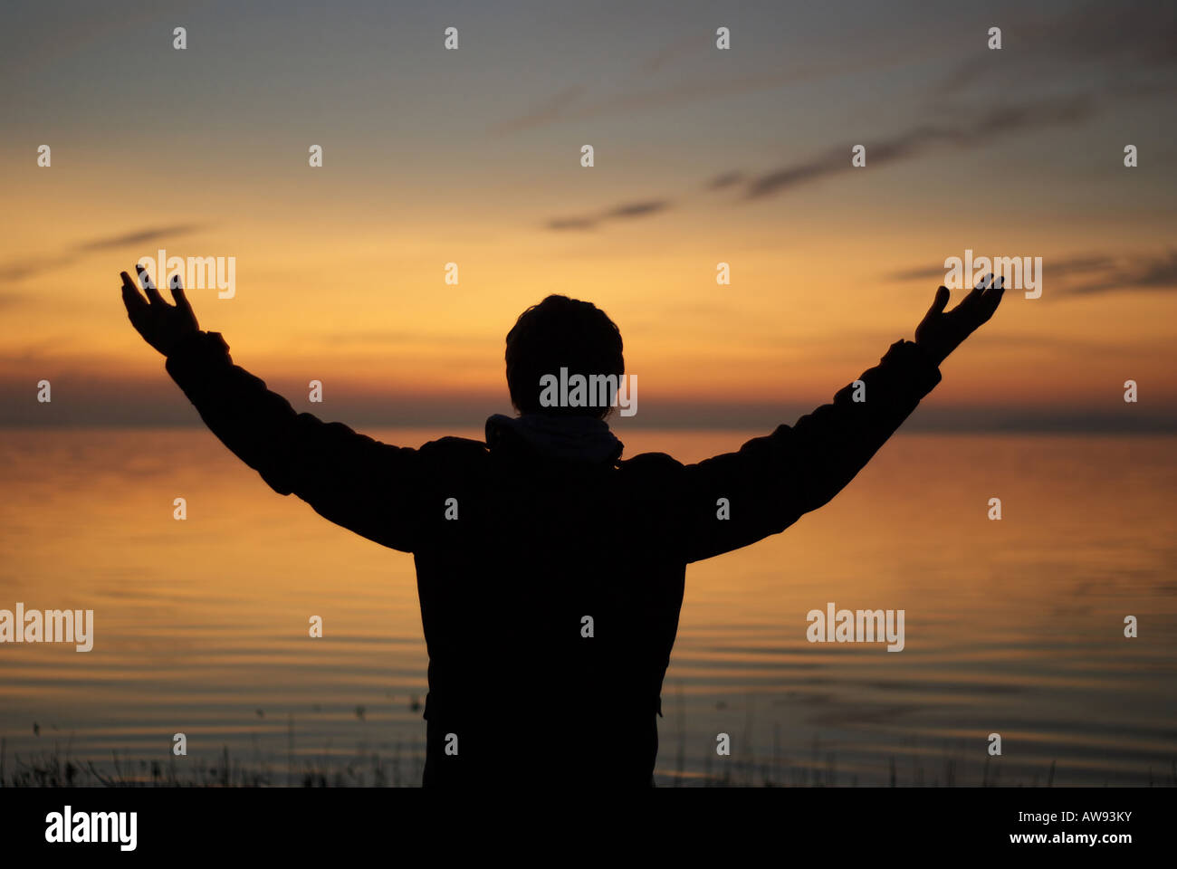 Silhoutte in front of a sunset Stock Photo - Alamy