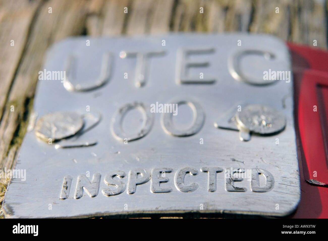 Metal inspected sign Stock Photo - Alamy