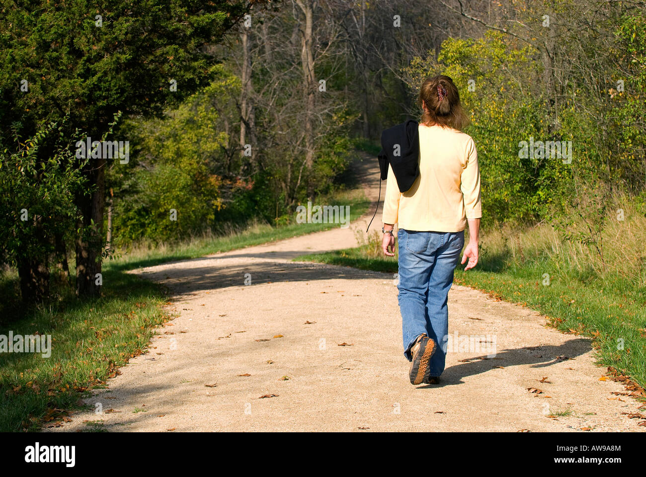 Woman walking exercise path Stock Photo - Alamy