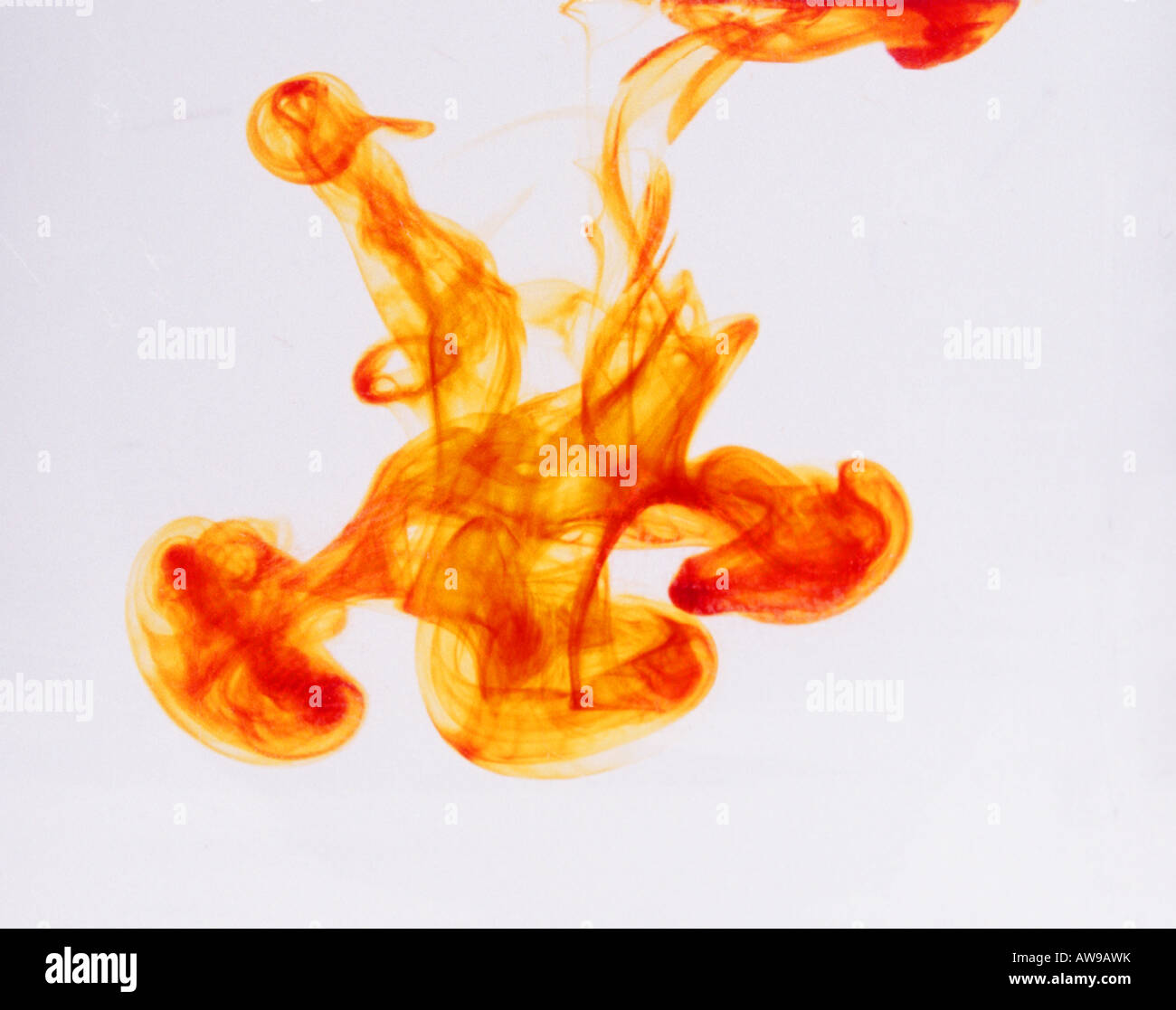 Diffusion of a drop of orange coloured water in clear water Stock Photo ...