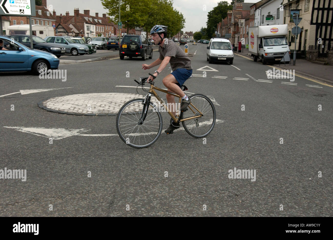 concentration is required when riding a bicycle in traffic Stock Photo ...