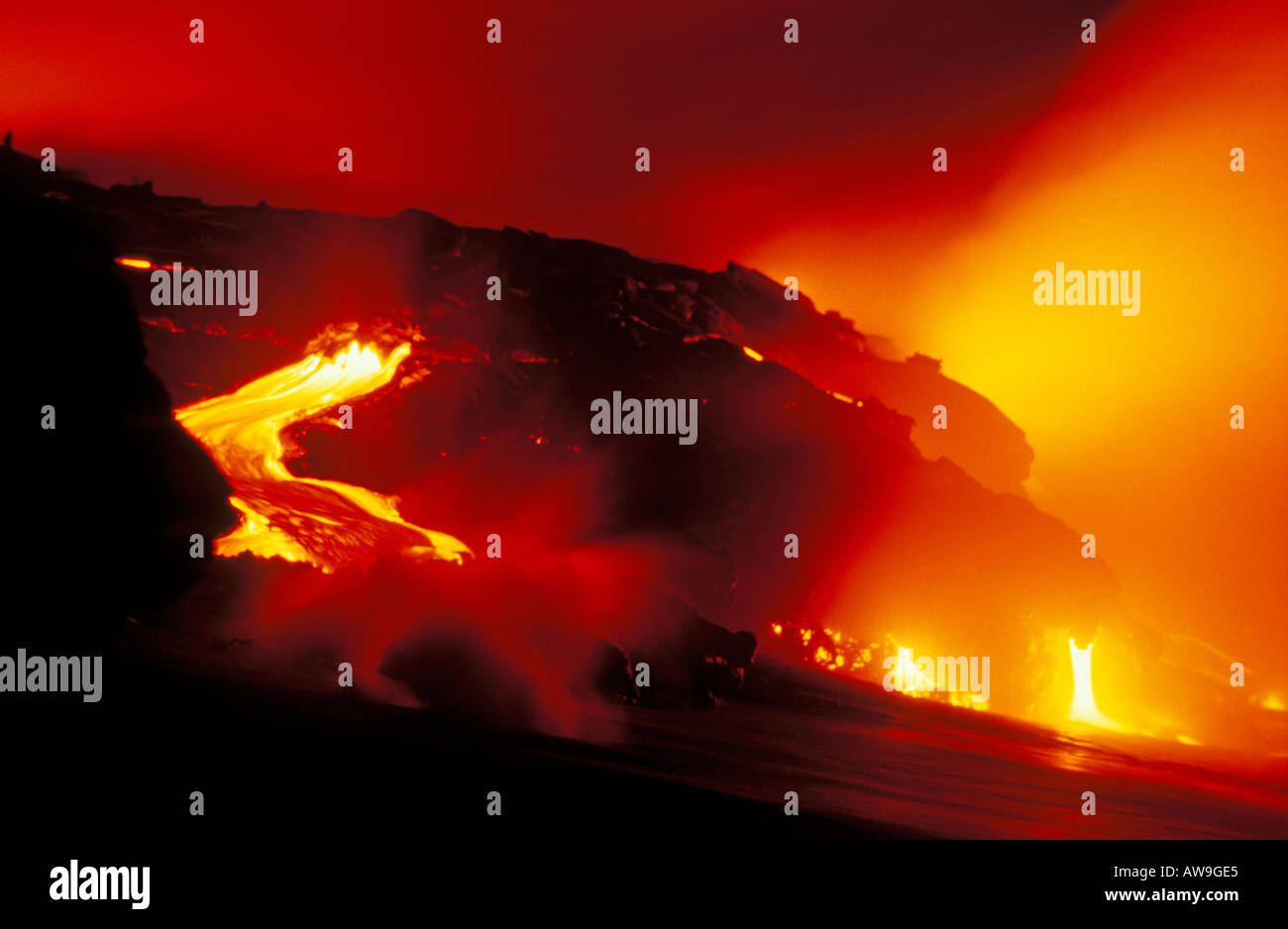 Lava flow entering the Pacific Ocean at night Hawaii Volcanoes National Park The Big Island ...