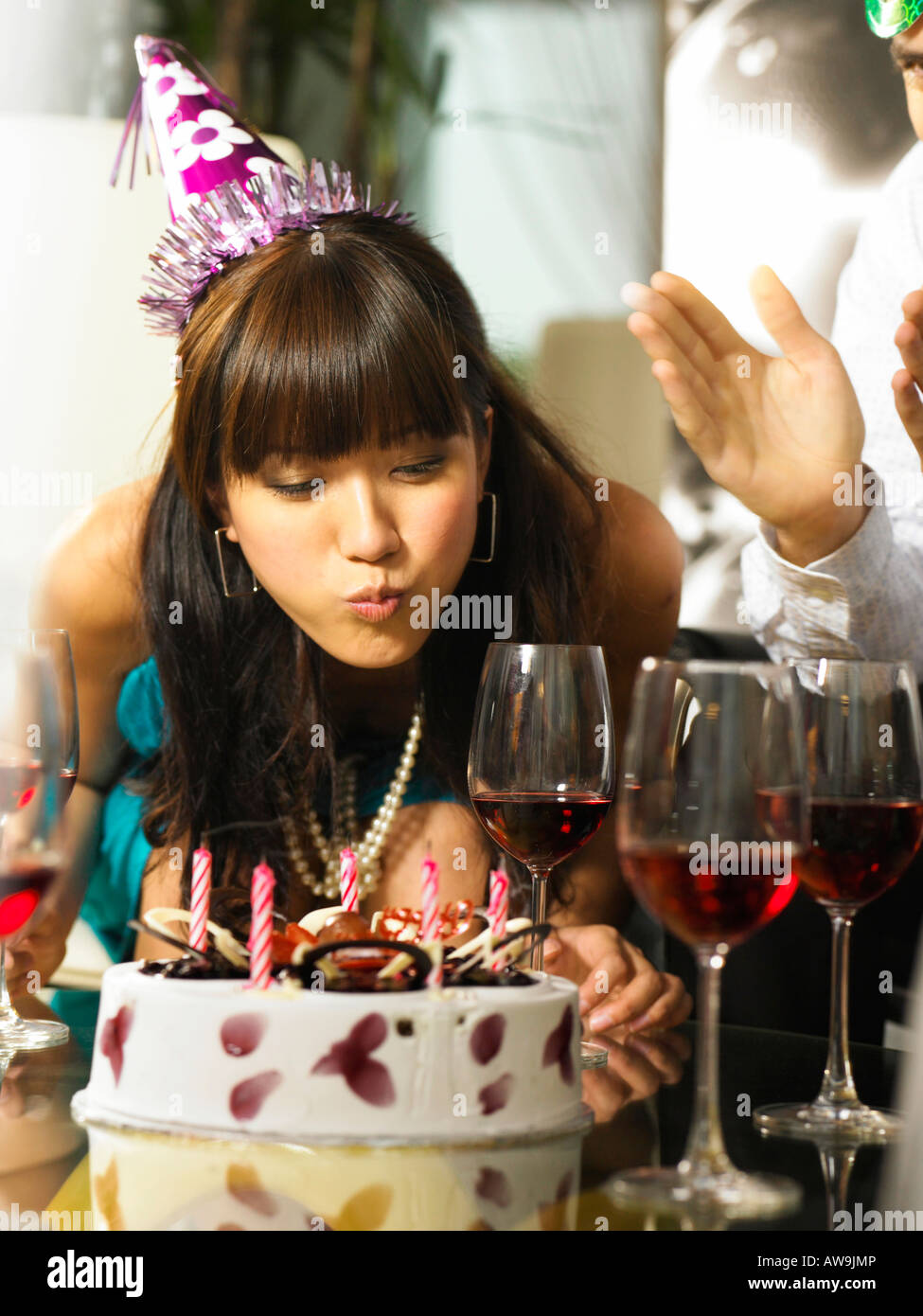 Woman blowing out candle dark hi-res stock photography and images - Alamy