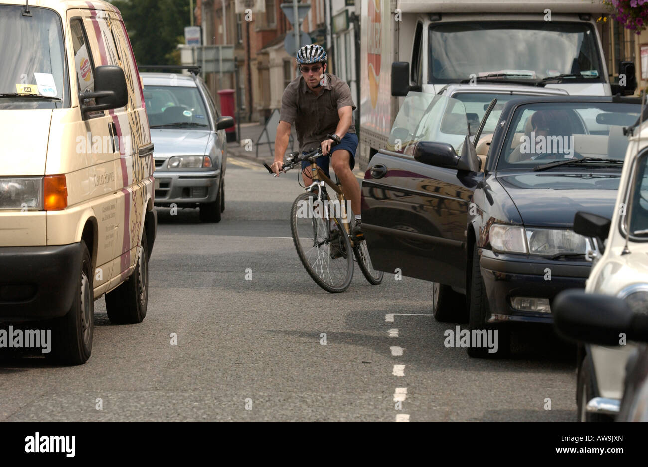 concentration is required when riding a bicycle in traffic Stock Photo ...